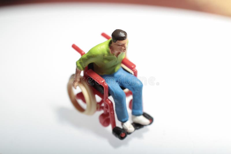 Miniature Figurine of a Disabled Man on a Wheelchair Stock Photo ...