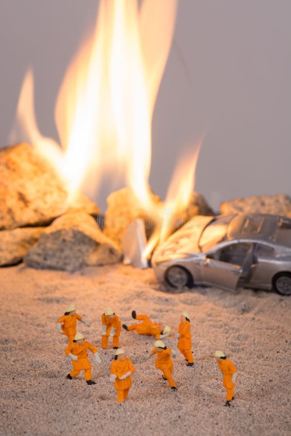 Miniature Firefighters Practicing Safety Fire Drill at a Car Accident ...