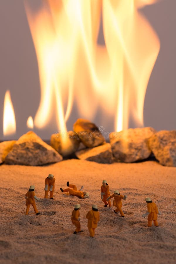 Miniature firemen at work stock image. Image of blazing - 62709437