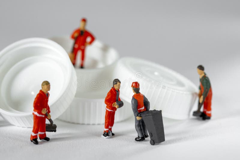 Miniature Garbage Man Cleaning and Sorting a Pile of Plastic Bottle ...