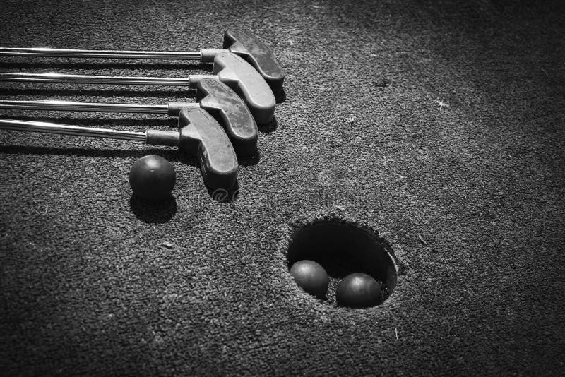 Miniature Golf Hole with Bat and Ball Stock Image - Image of ball ...