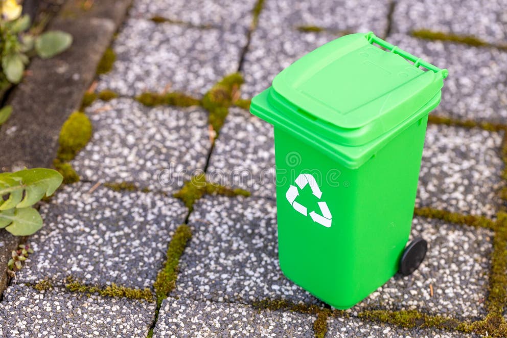 Miniature Green Garbage Bin for Biodegradable Waste, Standing on the ...