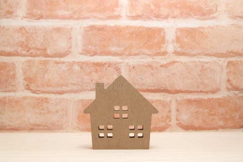 Miniature House in Front of Brick Wall. Stock Photo - Image of ...