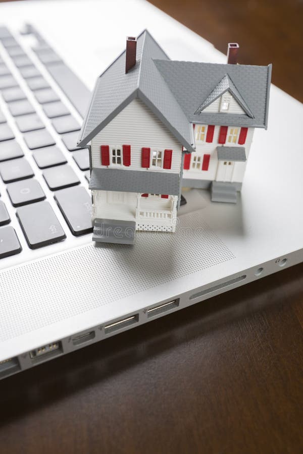 Miniature House on Laptop Computer Stock Photo - Image of online, real ...