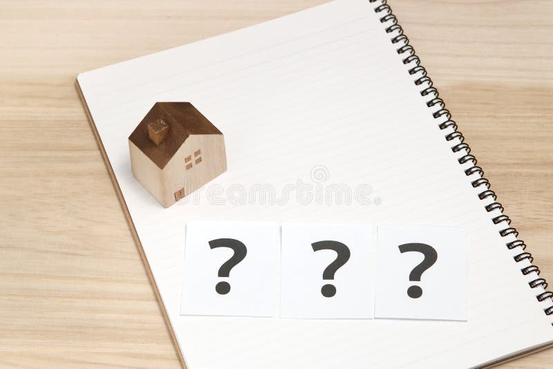 Miniature House and Many Question Marks on White Papers. House with ...