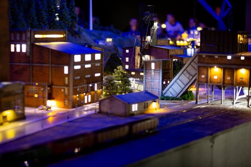 Miniature Industrial Mine Complex at Night with Illuminated Buildings ...