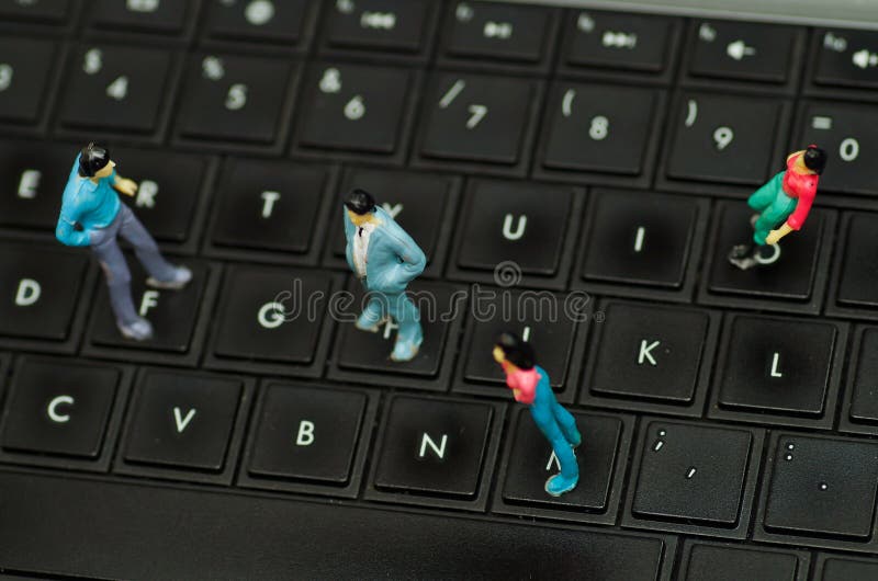 Miniature Little People, Group of Friends Over a Computer Keyboard, in ...