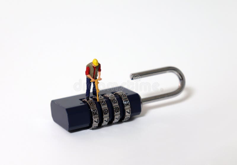 A Miniature Man Standing on a Unlocked Combination Lock. Stock Image ...