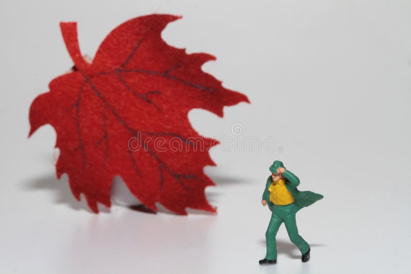 Miniature of a Man Walking Against the Autumn Wind Stock Photo - Image ...
