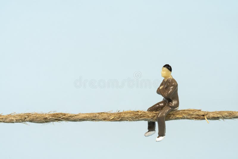 Man sitting on a rope stock image. Image of closeup - 243361907