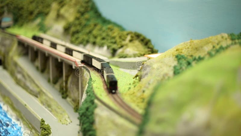 Miniature Model Scale Railway Steam Train with Wagons is Driving Stock ...