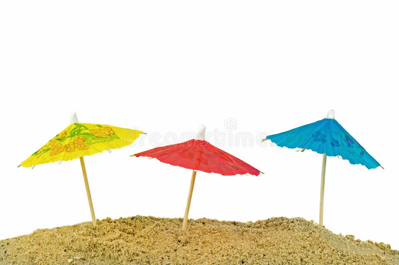 Miniature Paper Sun Umbrellas in Sand Stock Photo - Image of holiday ...