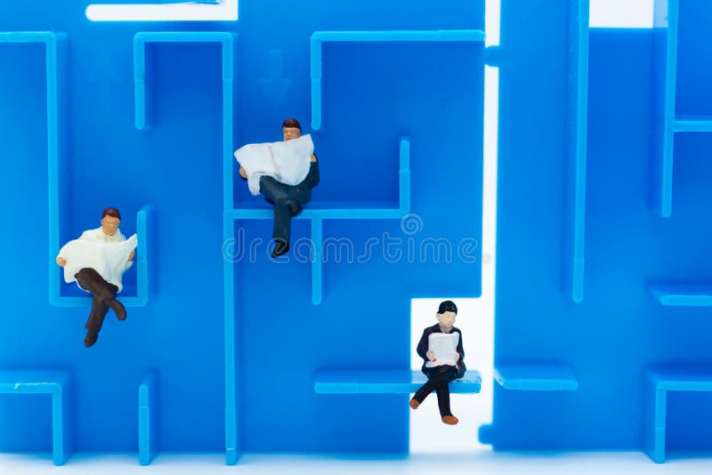 Miniature People: Businessman Reading Books on Maze. Image Use for ... Miniature People: Businessman Reading Books on Maze. Image Use for ...