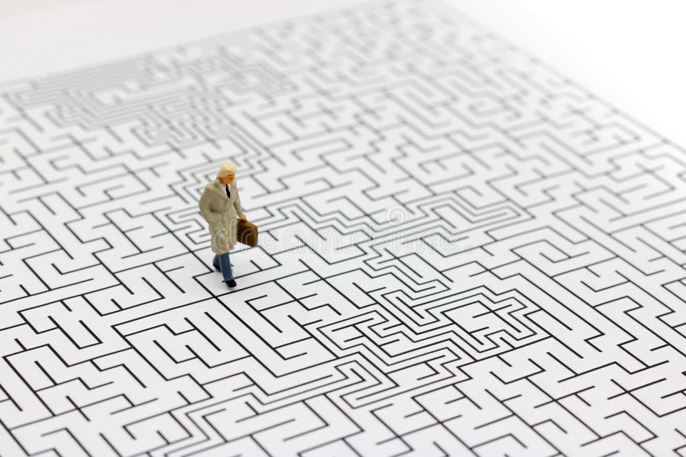 Miniature People: Businessman Standing on Center of Maze. Concepts of ...
