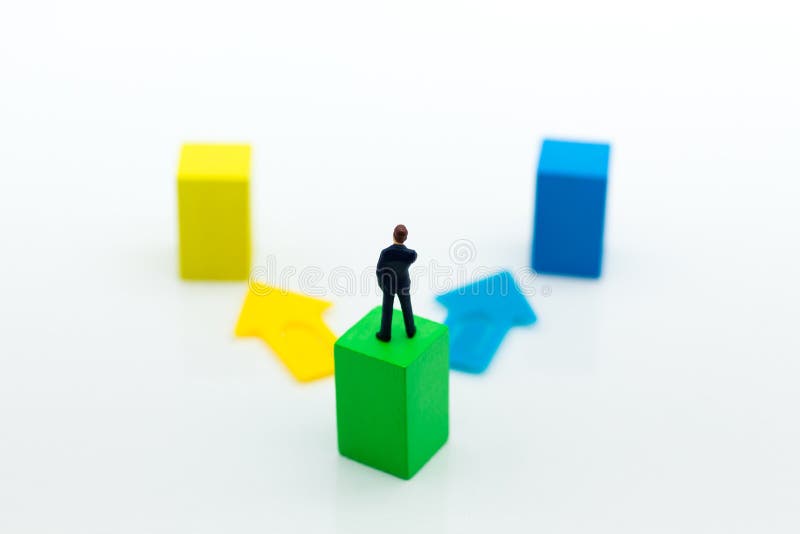 Miniature People Businessman Standing In Front Of Arrow Pathway Choice