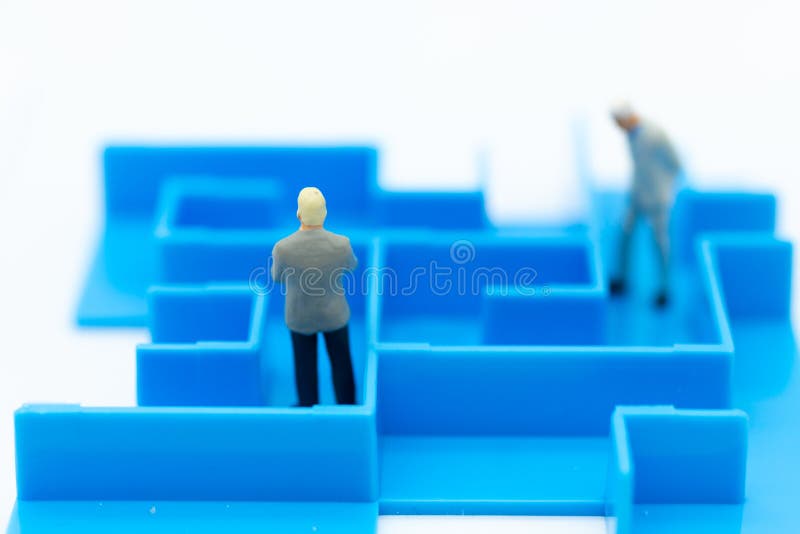 Miniature People: Businessman Standing with Maze. Image Use for Finding ... Miniature People: Businessman Standing with Maze. Image Use for Finding ...