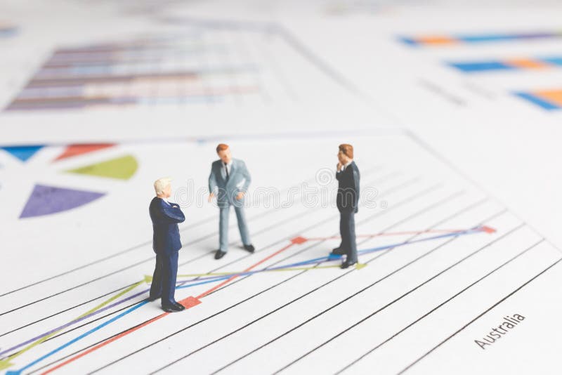 Miniature People : Businessman Standing on a Paper Graph Chart Stock ...