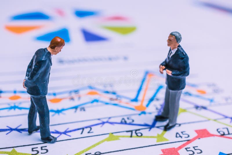 Miniature People : Businessman Standing on a Paper Graph Chart Stock ...