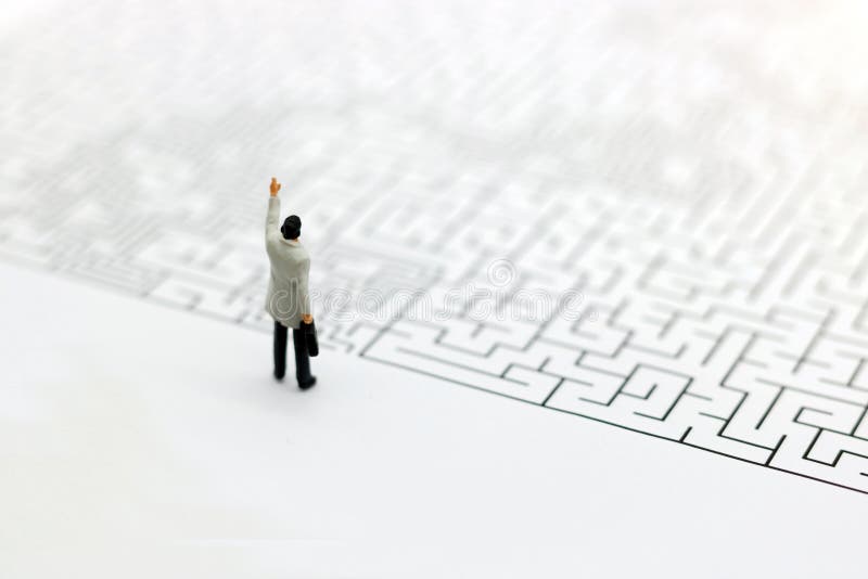 Miniature People: Businessman Standing on Start of Maze. Stock Image ...