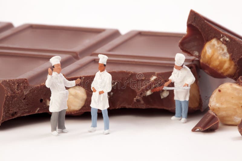 Miniature People: a Chef and Cooks in Front of a Chocolate Bar Stock ...