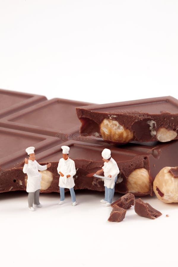Miniature People: a Chef and Cooks in Front of a Chocolate Bar Stock ...