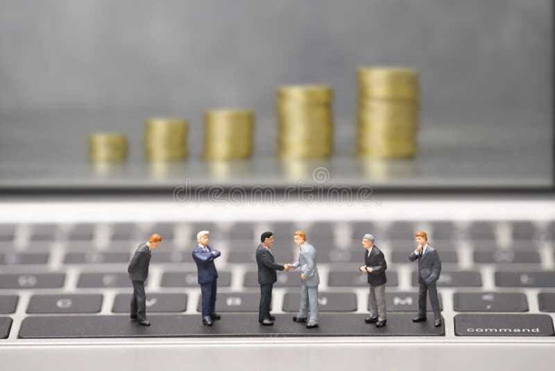 Miniature People on Computer Keyboard and Shaking Hand Stock Photo ...