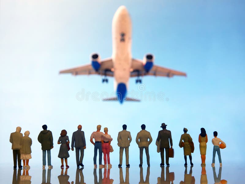 Miniature People. a Group of Different People Watching a Flying ...