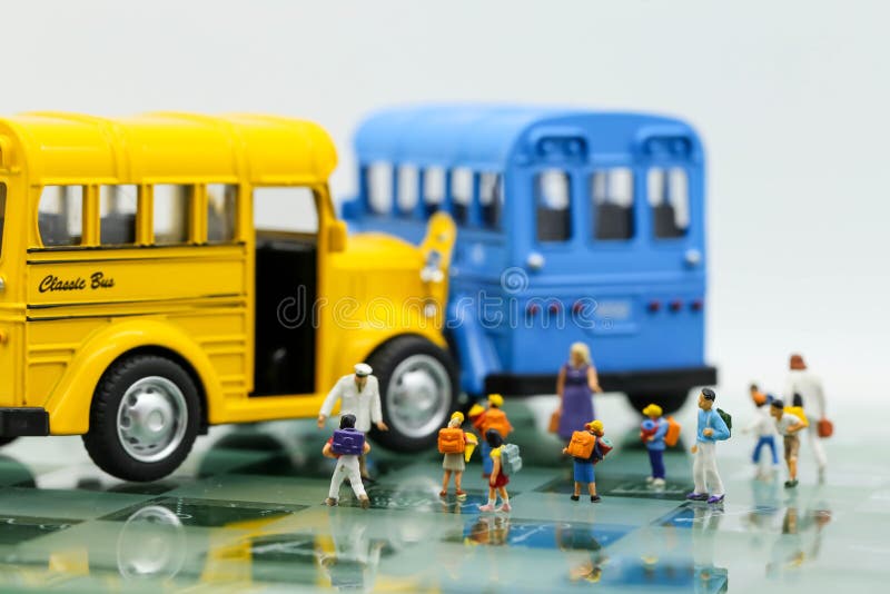 Miniature People : a Group of Young Children Getting on the Schoolbus ...