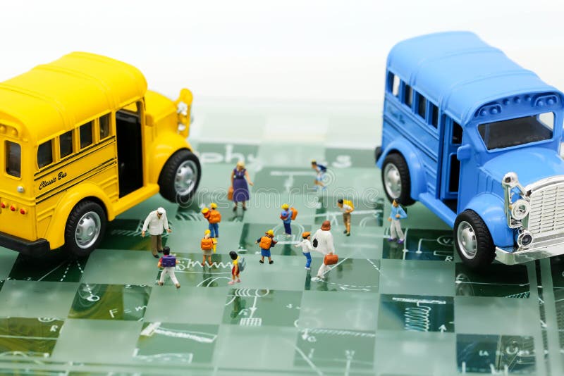 Miniature People : a Group of Young Children Getting on the Schoolbus ...