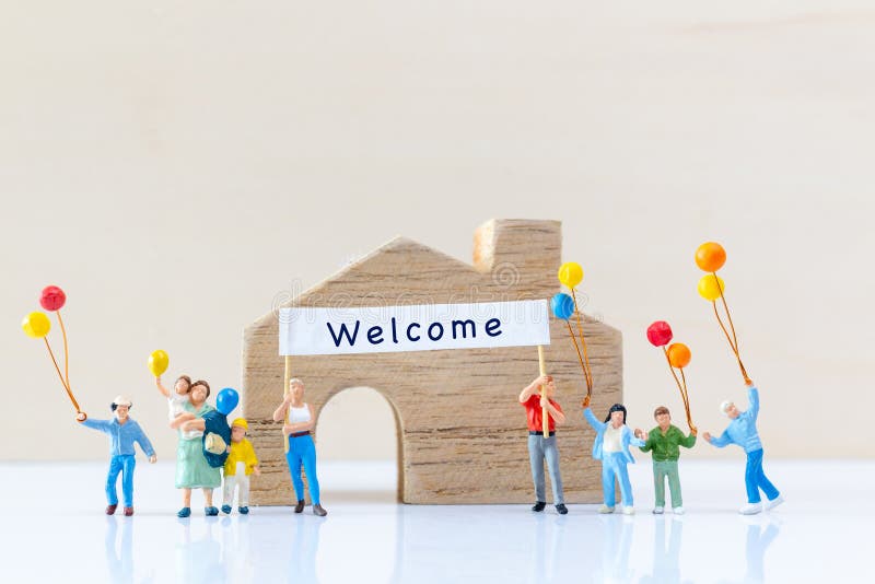 Miniature People Holding Welcome Signs at Front of the Home Stock Image ...