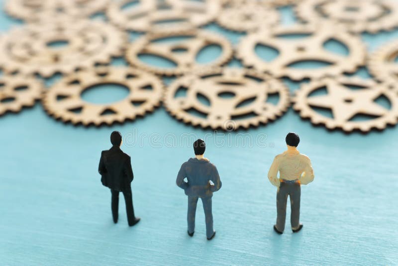 Miniature People Looking at Cogwheel in Set of Gears Mechanism. Problem ...