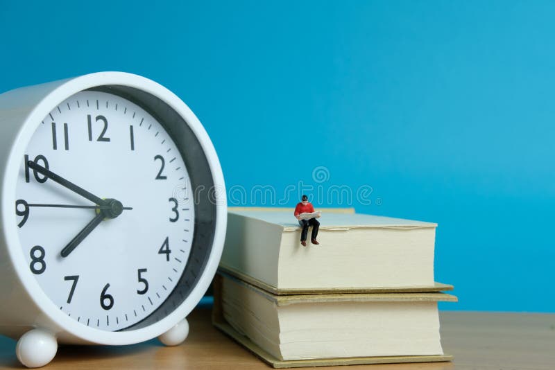 Miniature People for Morning Reading Time Concept - Young Man Seating ...