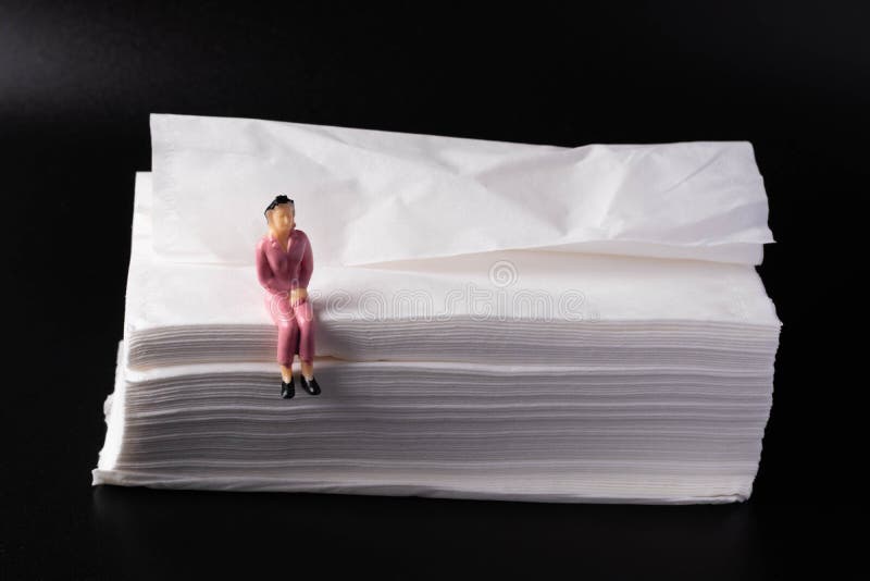 Miniature People, Sitting on a Pile of White Paper Stock Image - Image ...