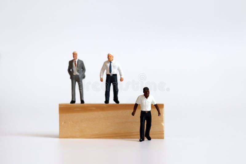 Miniature People Standing on Tree Blocks and Miniature Man Standing ...