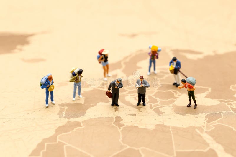 Miniature People : Traveler Reading a Map Using Concept of Map R Stock ...