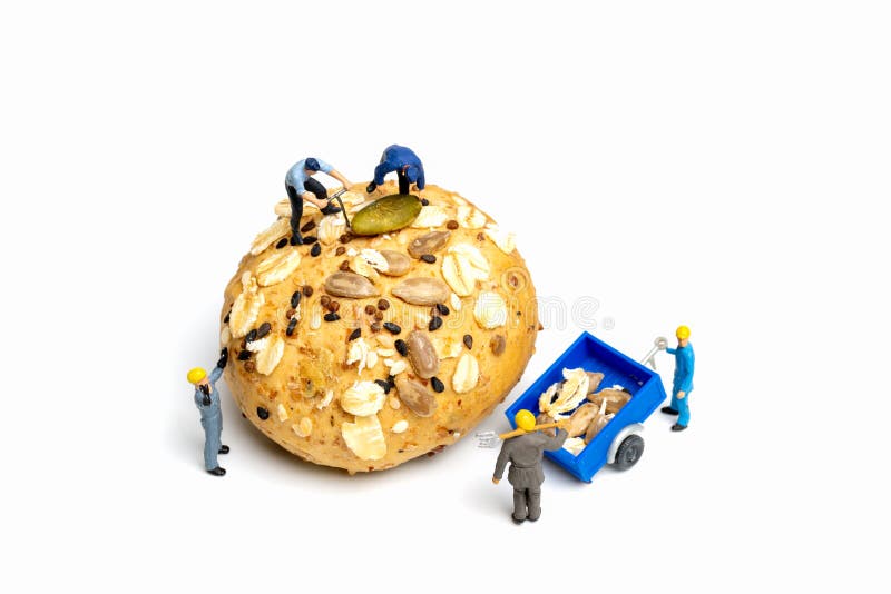 Miniature People Worker Team Working on Whole Grain Bread Stock Image ...