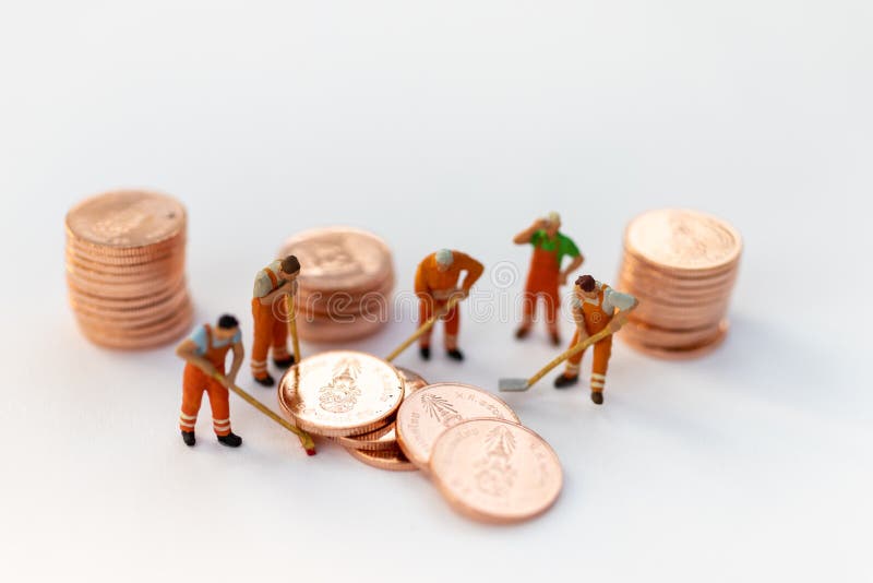 Miniature People: Worker Working on Stack of Coins, Income from Work ...