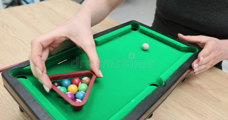 Miniature Pool Table with Colorful Balls on a Green Table Stock Video ...