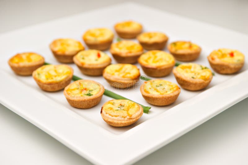 Mini Quiche Appetizers in Rows Stock Photo - Image of pastry, white ...