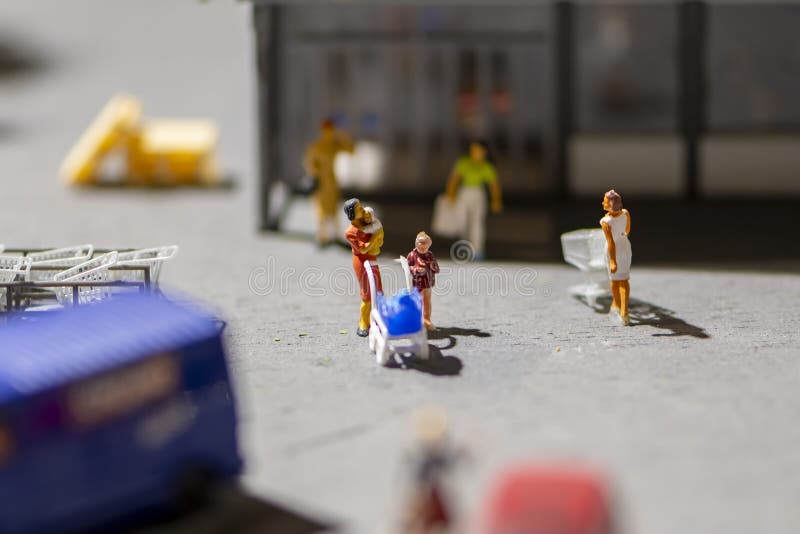 A Miniature Scene, People Enter and Exit the Supermarket with Purchases ...