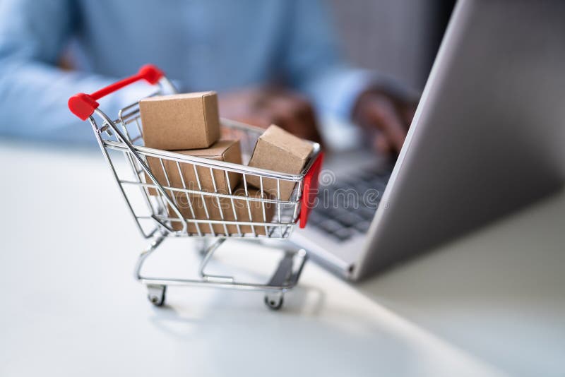 Miniature Shopping Cart in Front of a Person Stock Photo - Image of ...