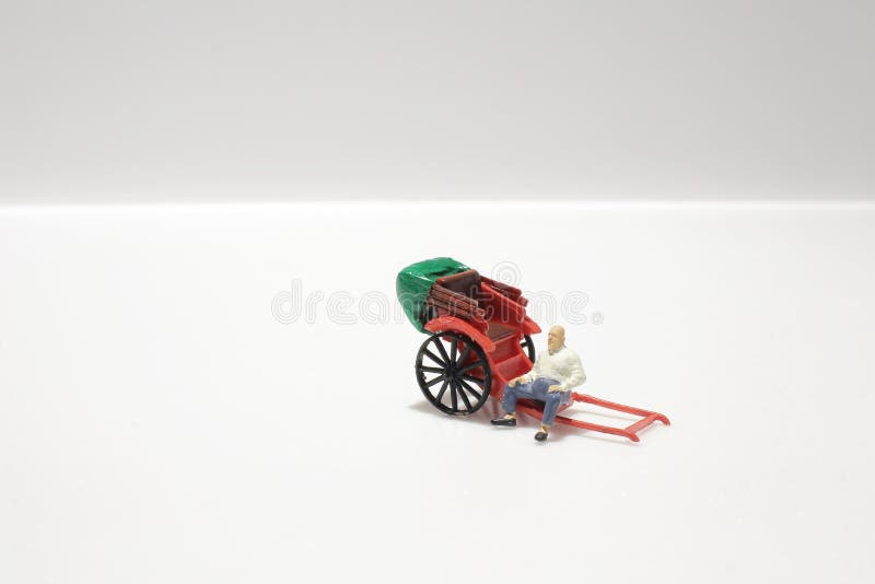 Miniature Statue and Red Vintage Oriental Rickshaw Cab Stock Photo ...
