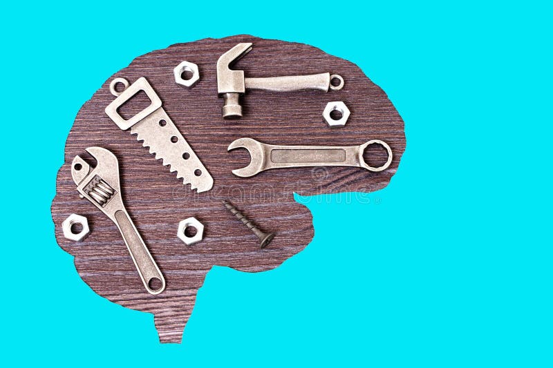 Miniature Tools Inside a Brain-Shaped Figure Stock Photo - Image of ...