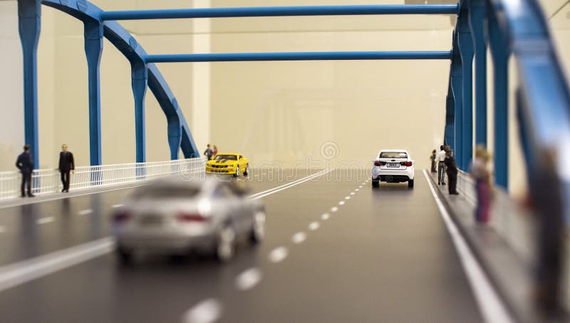 Miniature Toy Cars and People on the Bridge Stock Image - Image of city ...