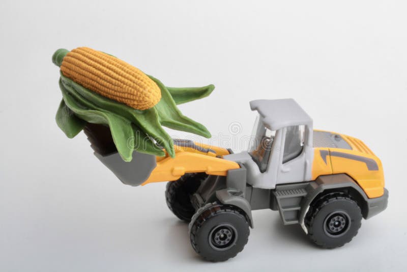 Miniature Toy Excavator Lifting Up Corn Cob Stock Photo - Image of ...