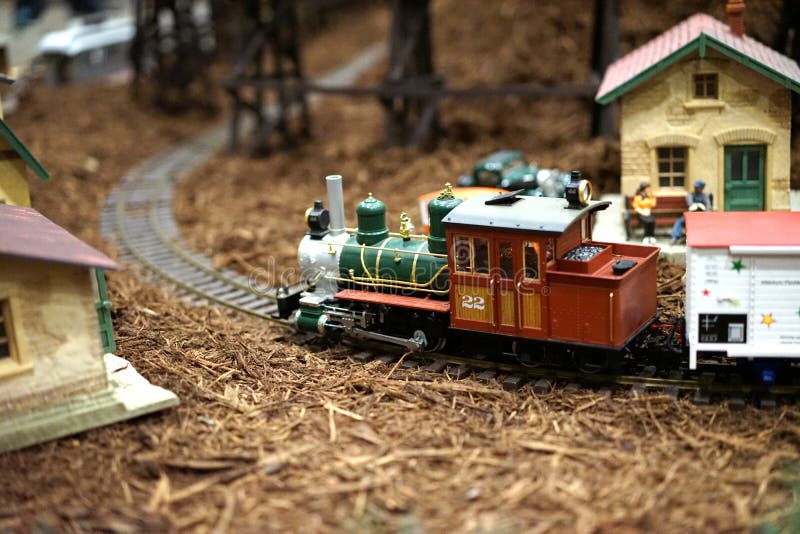 Miniature Train Leaving Town Stock Image - Image of mulch, model: 67612821