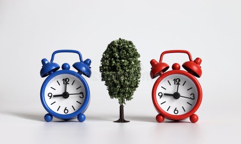 A Miniature Tree between Two Alarm Clock. Stock Image - Image of alarm ...