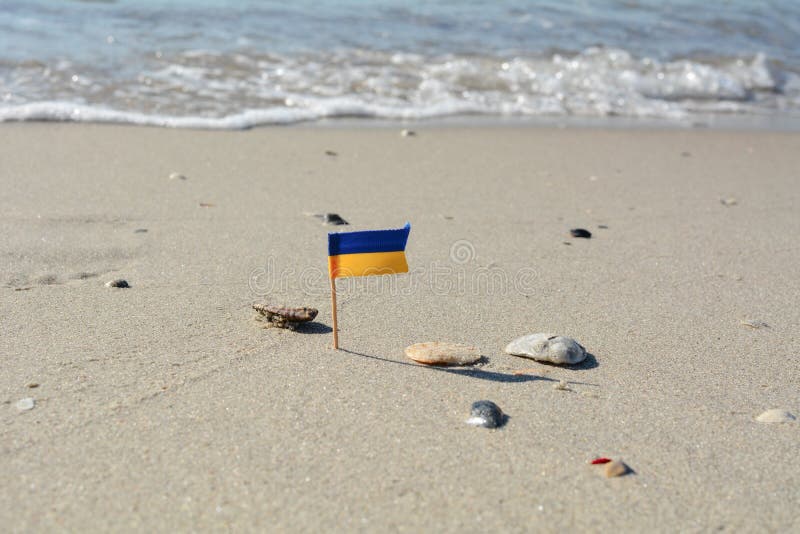 Miniature Ukrainian Flag on the Beach of the Black Sea Selective Focus ...