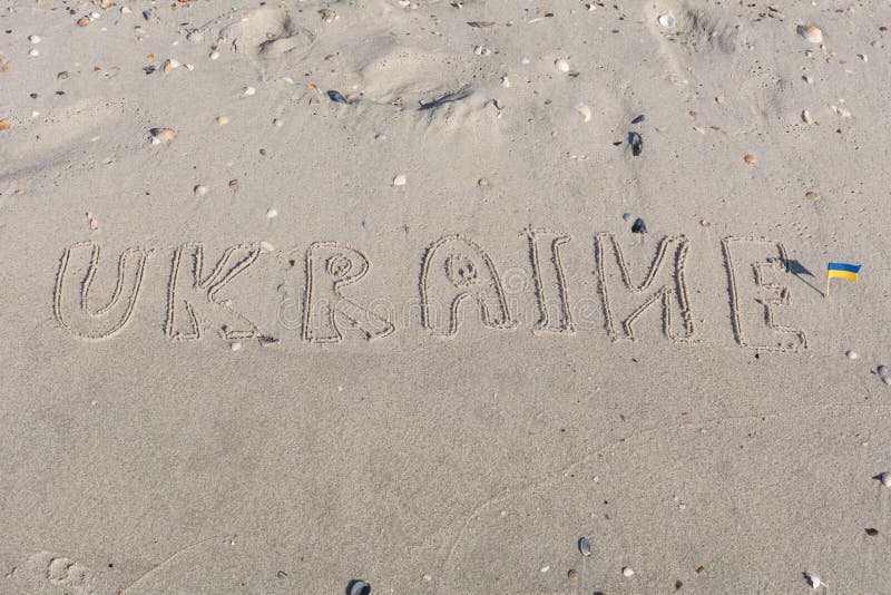 Miniature Ukrainian Flag on the Black Sea Beach Stock Photo - Image of ...