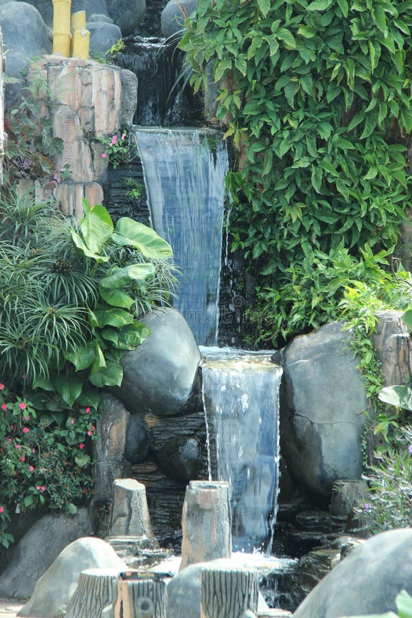 Miniature waterfall stock photo. Image of water, lawn - 213506366